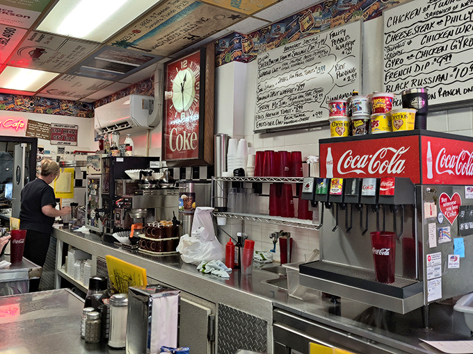 Behind-the-scenes magic happens here, where Coca-Cola signs watch over breakfast prep like guardian angels. 