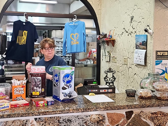 The register area adorned with local treats and friendly service&mdash;where transactions feel more like conversations with neighbors.