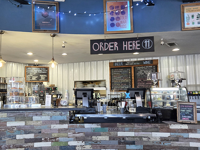 The "Order Here" sign hangs like a beacon of hope, promising delicious rewards for those brave enough to approach the counter.
