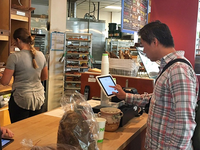 The counter experience: where anticipation meets reality. That moment when you're one transaction away from holding heaven in a paper bag.