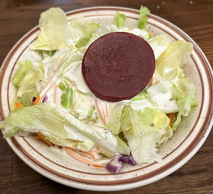The humble salad with its slice of beet&mdash;the opening act that deserves its own applause. Simple, fresh, and unapologetically old-school.