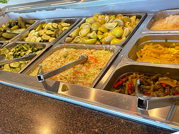 The salad bar&mdash;a colorful United Nations of vegetables where pickles diplomatically negotiate with coleslaw for your attention.