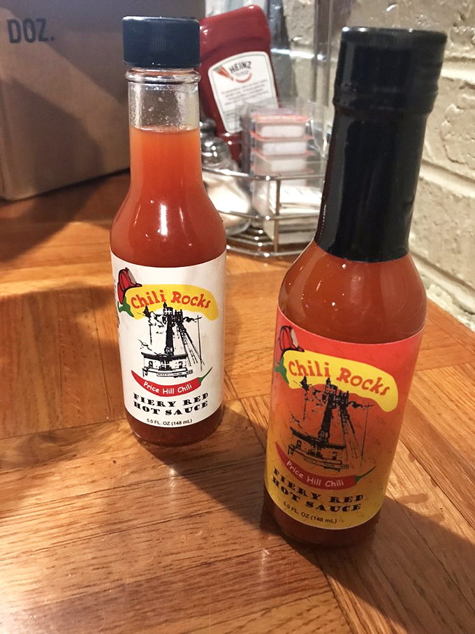 Hot sauce bottles proudly displaying the Price Hill Chili name&mdash;take some home and make your refrigerator infinitely more interesting.