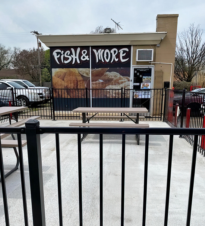 The outdoor seating area offers a no-nonsense dining experience. Picnic tables say, "Focus on the food, not the furniture."