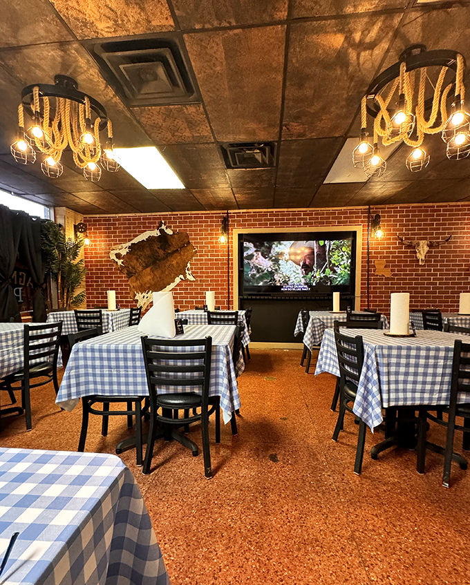Copper ceiling tiles and cowhide wall art create that "upscale ranch house meets barbecue joint" ambiance that just feels right.