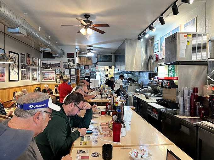 Where the regulars gather to solve the world's problems over eggs and coffee. The ceiling fans keep the conversation flowing as smoothly as the syrup.