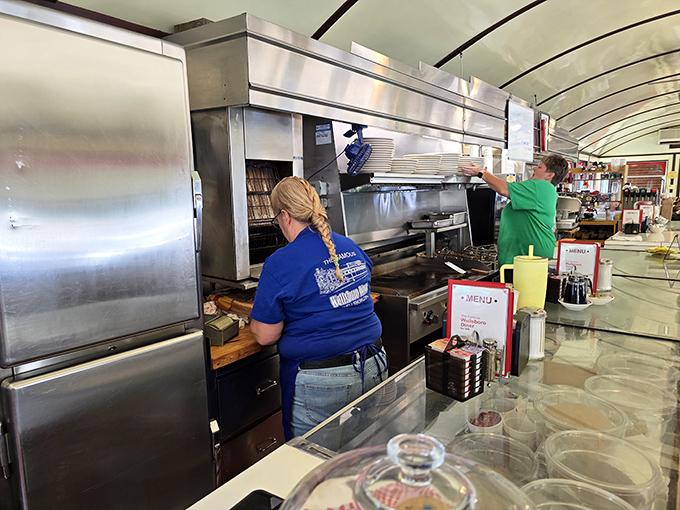 Skilled hands at work&mdash;where breakfast isn't just a meal, it's a choreographed performance that's been perfected over decades.