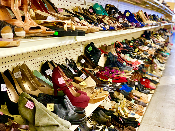 The shoe section stretches like a red carpet of footwear fame, where designer heels rub soles with practical flats in a democratic display.