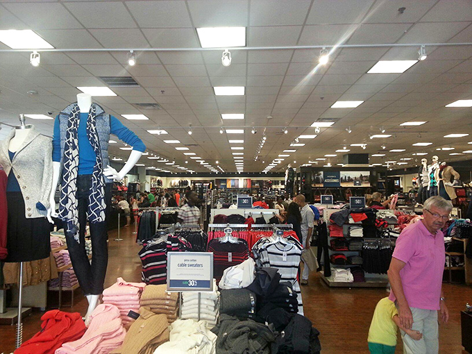 Department store outlets offer the thrill of the hunt across vast retail savannas. That gentleman in pink has clearly mastered the art of the outlet expedition.