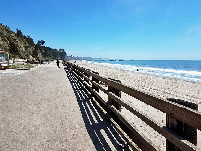 The beach promenade invites leisurely strolls with the Pacific on one side and coastal bluffs on the other. Exercise with benefits beyond the physical.