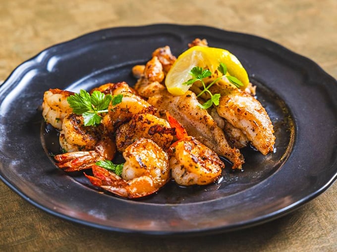 Perfectly seasoned shrimp that look like they just had a spa day in butter and spices before posing for their glamour shot.