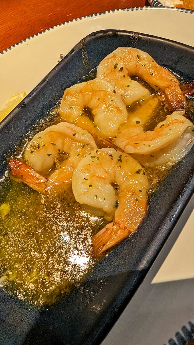 Shrimp scampi swimming in garlicky butter that begs to be sopped up with those famous biscuits. Simple perfection that never goes out of style.