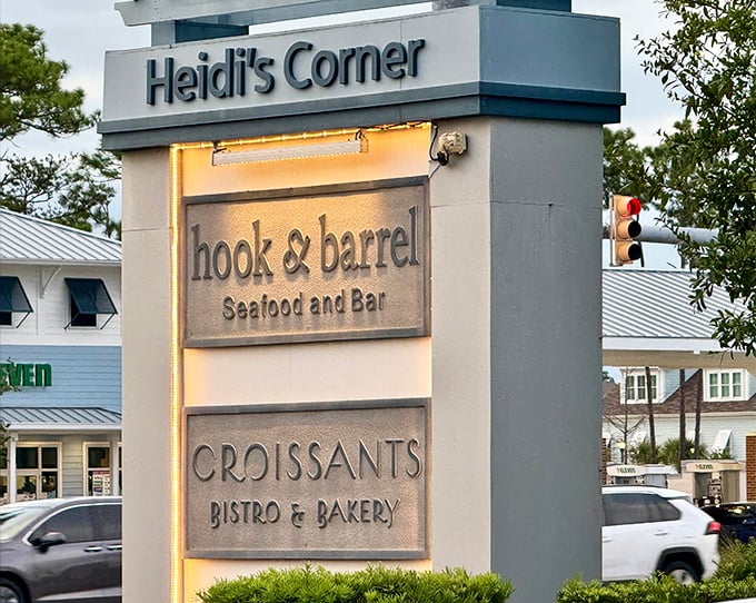 The sign outside Heidi's Corner announces a trifecta of culinary delights, with Hook & Barrel taking center stage in this gastronomic family.