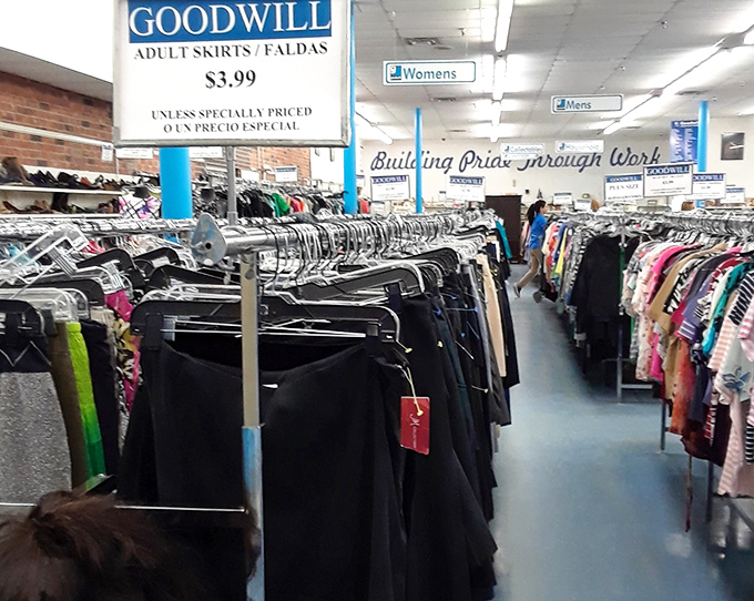 A forest of hanging skirts where $3.99 buys you style that someone else paid full price to barely wear. Fashion karma exists! 