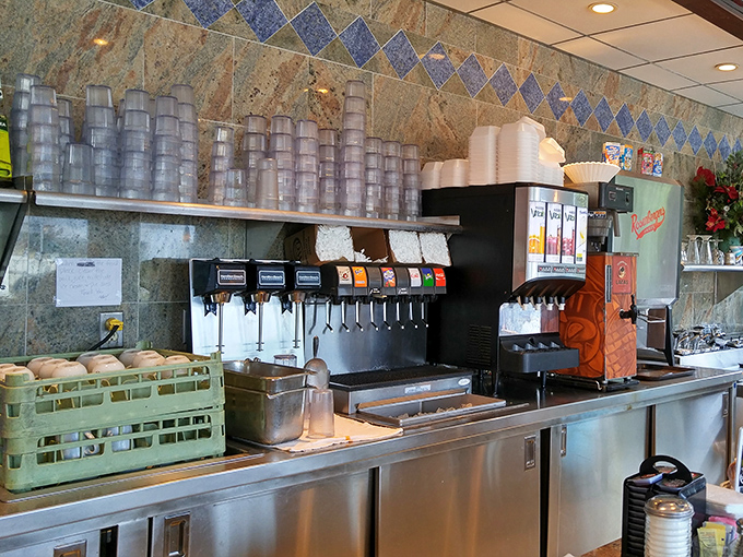 The drink station stands ready for battle, armed with enough caffeine and sugar options to fuel a small army of morning commuters.