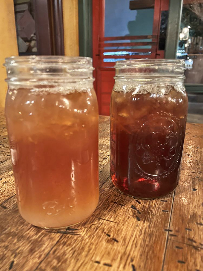 Sweet tea and something darker &ndash; the official beverages of serious BBQ appreciation, served in jars because glasses are too fancy.