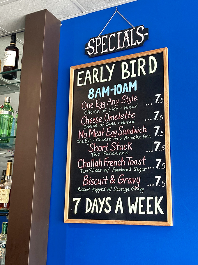 The Early Bird specials board—proof that getting up with the roosters has its rewards. Breakfast democracy at its finest.