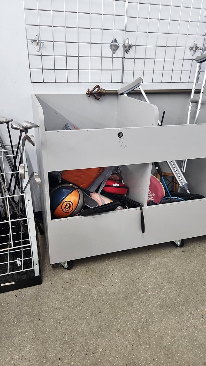 A sink cabinet repurposed as sports equipment storage proves thrifting isn't just about buying&mdash;it's about reimagining possibilities.