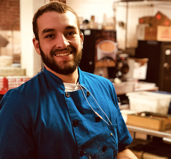 The passion behind the plates: skilled hands and genuine smiles ensure your dining experience matches the impressive setting.