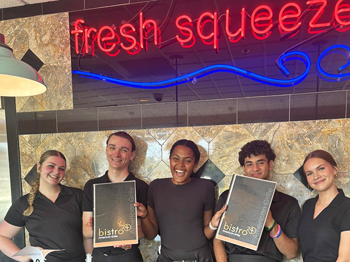 The staff proudly displays their menus like awards. When you're serving food this good, every plate is a potential trophy.