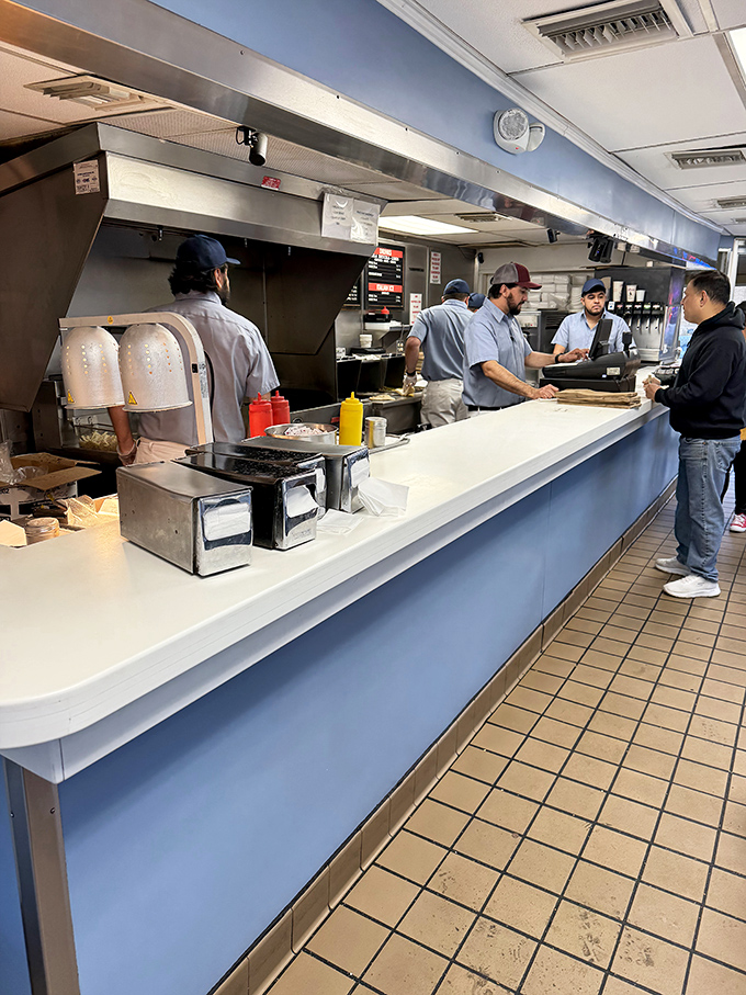 The counter crew moves with the precision of a well-rehearsed orchestra. Your sandwich is their masterpiece.