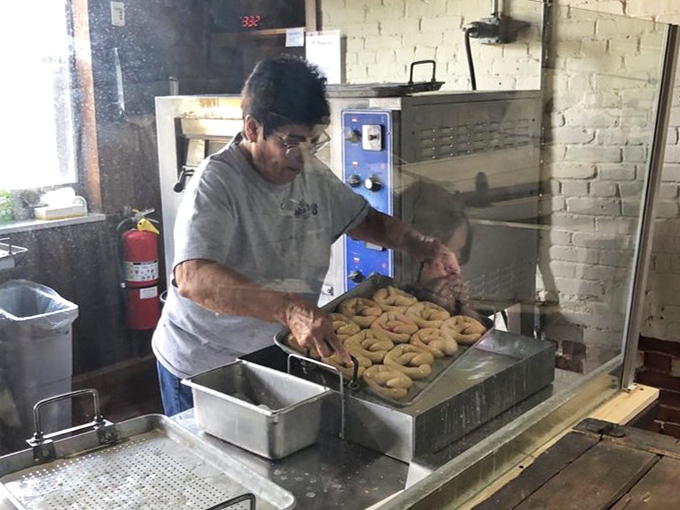 Watching a master baker at work is like seeing a conductor lead an orchestra &ndash; except instead of music, you get perfectly golden pretzels as the finale.