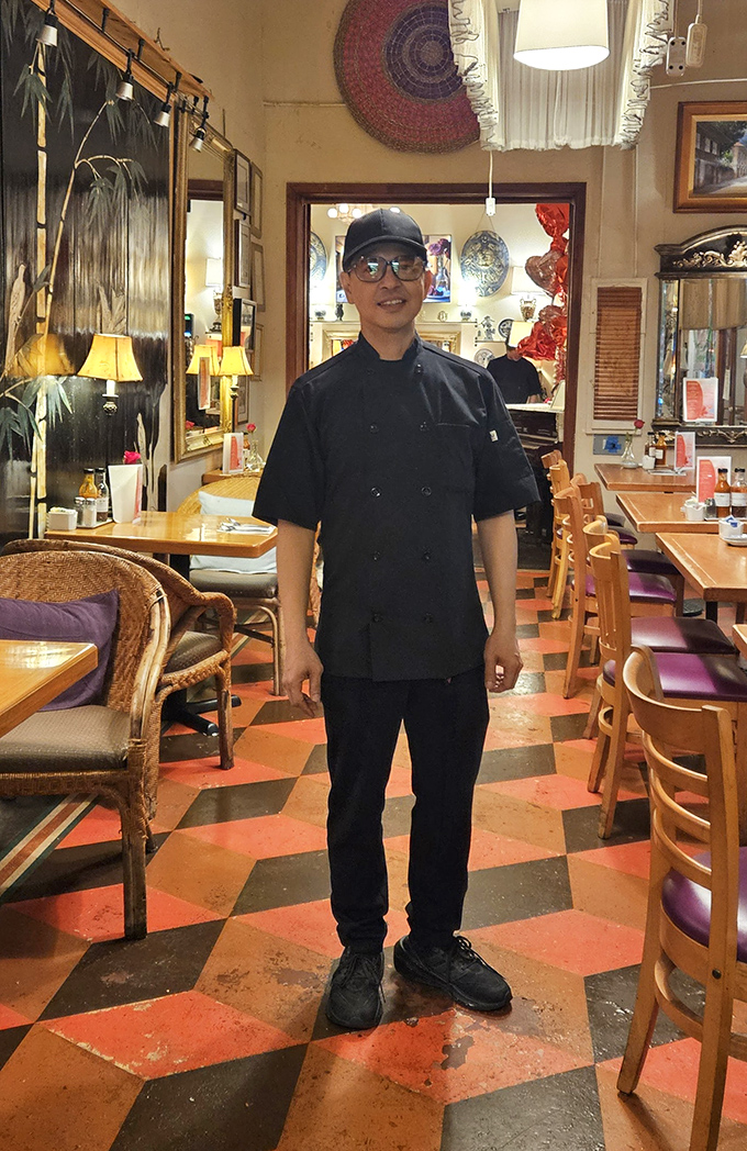 Behind every great restaurant is someone who treats food like art. That smile says, "Just wait until you taste what's coming out of my kitchen."