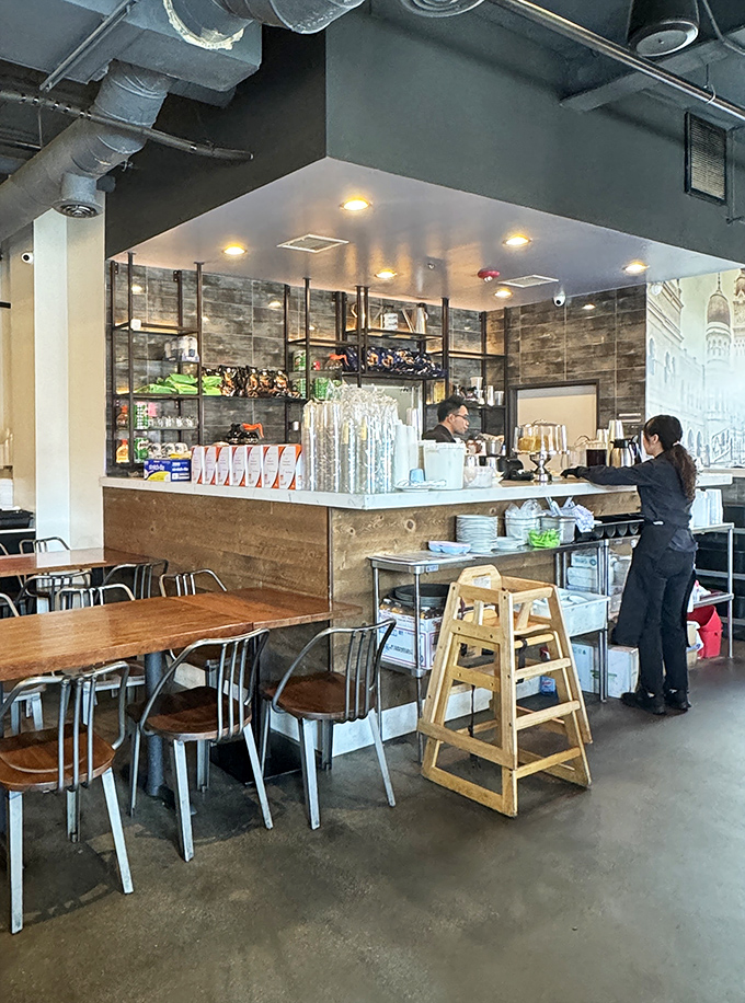 Where the magic happens: the open counter design lets you witness the careful orchestration that turns ingredients into edible memories.