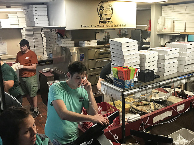 Behind every great breadstick is a dedicated team. The kitchen hustles to keep up with the constant demand for cheese-filled perfection.