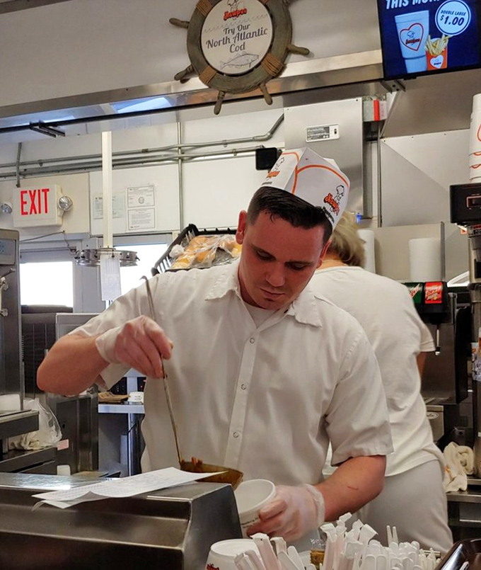 Behind the counter, staff work with the practiced precision that comes only from years of perfecting the art of the perfect burger flip.