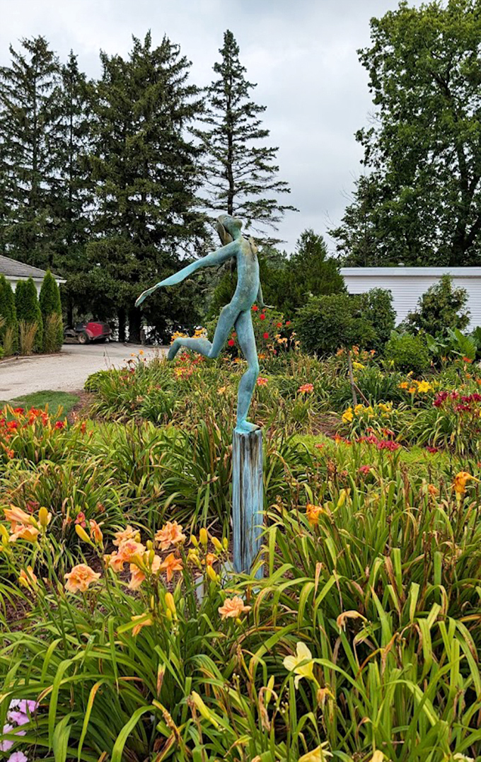 She stands in silent contemplation, surrounded by a halo of blooms. This serene figure reminds us to pause and absorb the beauty around us.