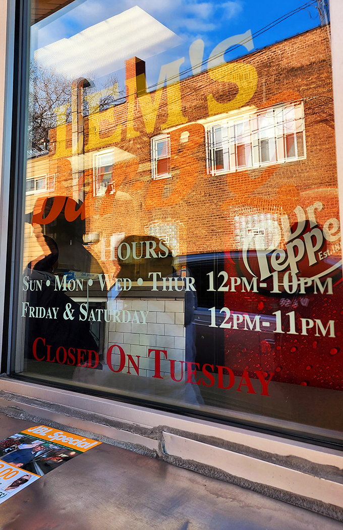 Hours of operation displayed on the window. Plan accordingly or risk the heartbreak of finding "CLOSED" when your ribs craving hits.