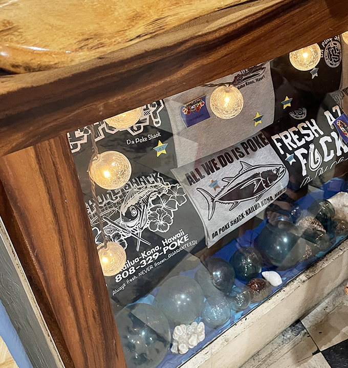 Even the merchandise display whispers of ocean depths and island pride. Souvenirs that remind you of flavors rather than tourist traps.