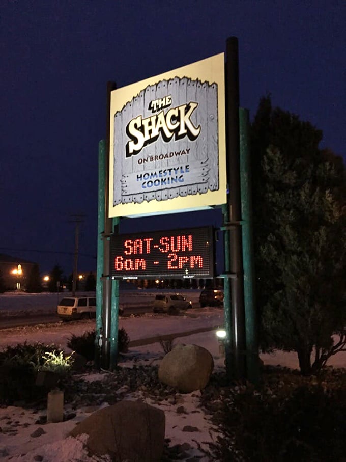 The Shack's illuminated sign cuts through the darkness like a lighthouse, guiding hungry souls to breakfast salvation even on winter mornings.