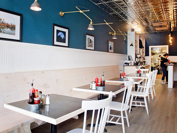 Navy blue walls and white wainscoting create the perfect backdrop for Montana morning rituals. Simplicity that lets the food be the real conversation starter.