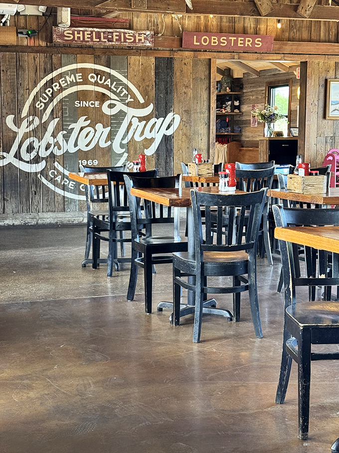 The dining room where "I'll just have a salad" goes to die. That wall logo silently judges anyone who doesn't order seafood.