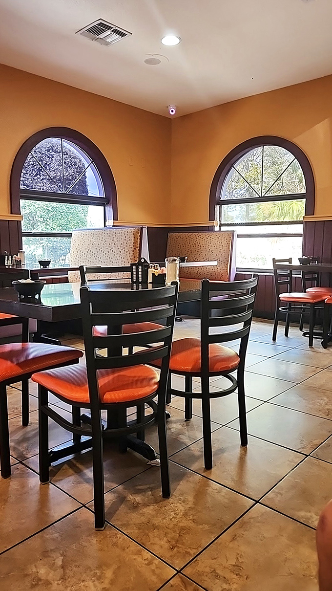 Corner booths bathed in natural light from arched windows &ndash; the kind of seating real locals fight over with polite determination.