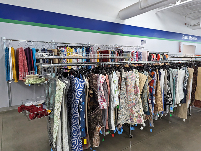 Textile treasures organized by color, creating a thrifter's paradise where pattern-mixing becomes an Olympic sport.