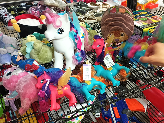 Stuffed animals huddle together like old friends at a reunion, each hoping to be the chosen one for a child's bedroom.