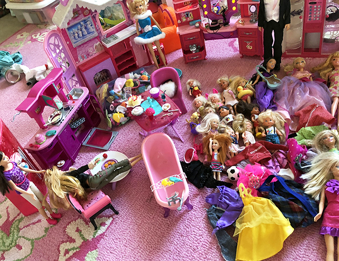 Barbie's yard sale exploded in aisle seven! Pink plastic dreams and doll fashion disasters create a miniature landscape of childhood nostalgia.