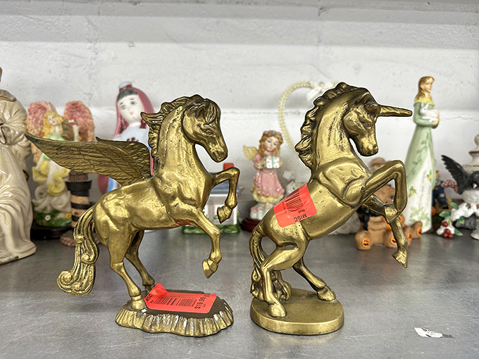 Golden unicorns standing proudly among ceramic companions. In the thrift world, these mythical creatures are surprisingly affordable roommates.