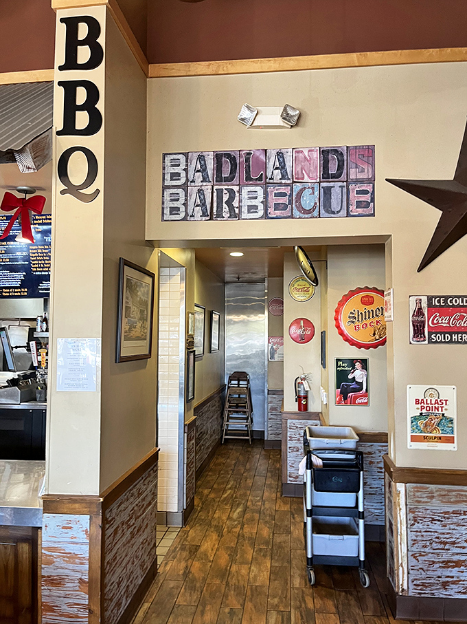 The hallway to BBQ heaven is adorned with vintage signs and rustic charm&mdash;a prelude to the smoky delights that await.