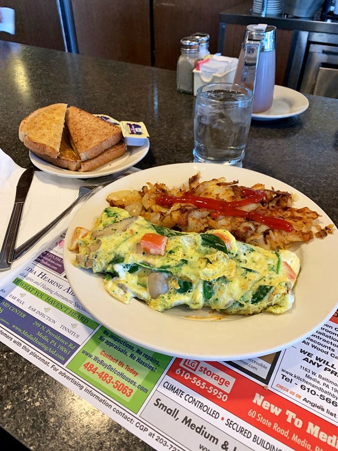 An omelet that's managed to incorporate an entire farmer's market&mdash;fluffy eggs embracing fresh vegetables in a morning marriage made in heaven.