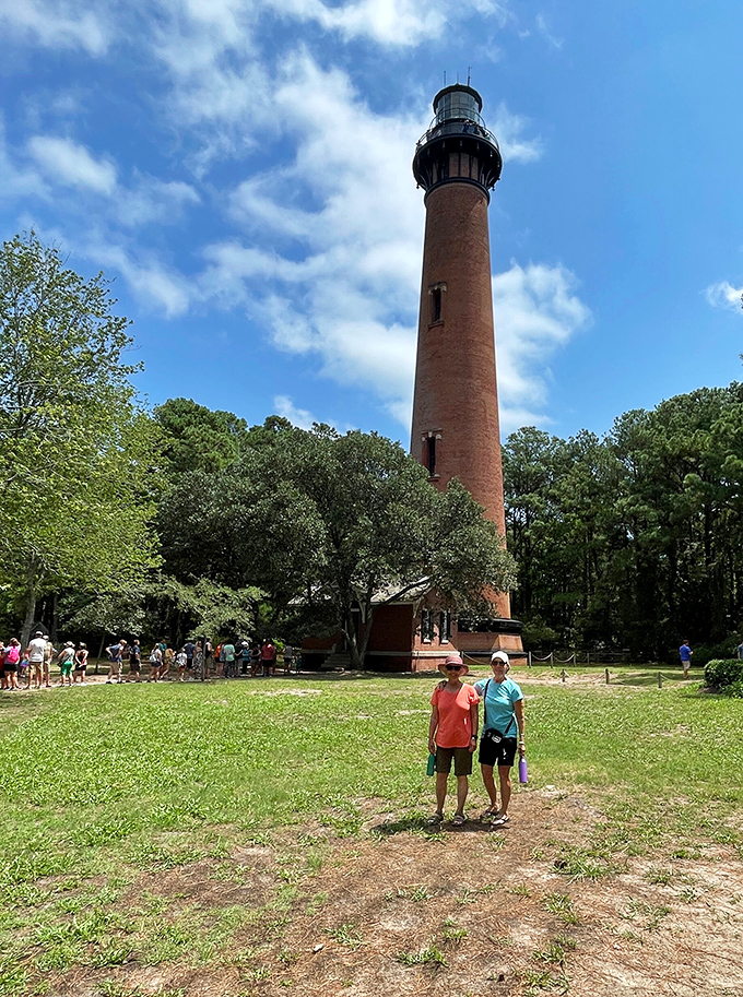Visitors gather at the base, their upturned faces sharing the same expression: "That's a lot of stairs, but I bet the view is worth it."