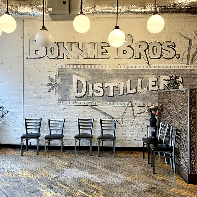 History whispers from these white brick walls. The distillery signage reminds you that in Kentucky, bourbon isn't just a drink&mdash;it's heritage.