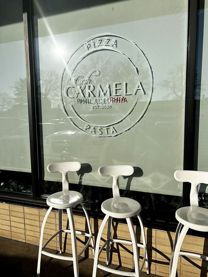 The window logo promises "Pizza" and "Pasta"&mdash;two of the most beautiful words in any language. Those white stools are calling your name.