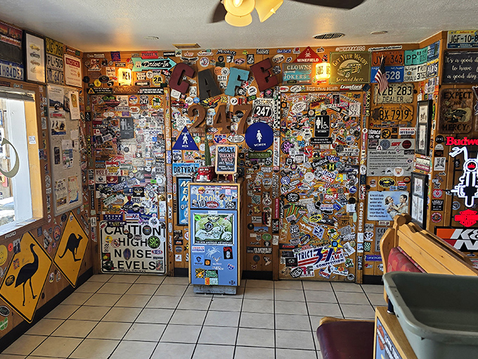 Not an inch wasted in this shrine to American road culture. Stickers, signs, and memorabilia creating a visual feast that rivals the actual menu.
