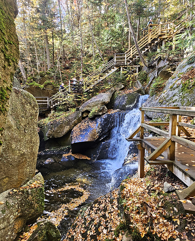 Wooden walkways and waterfalls create a peaceful outdoor experience that complements the underground adventure. Nature's front porch to the main cavern event.