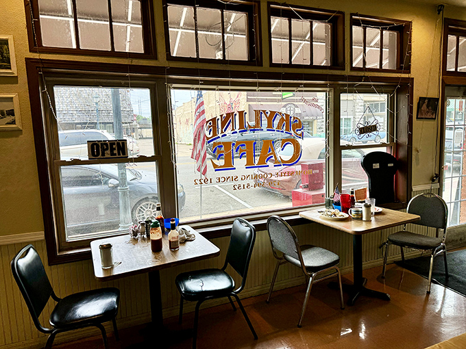 Window seats offer prime people-watching with a side of small-town charm. The "OPEN" sign is always a welcome sight for hungry Mena residents.