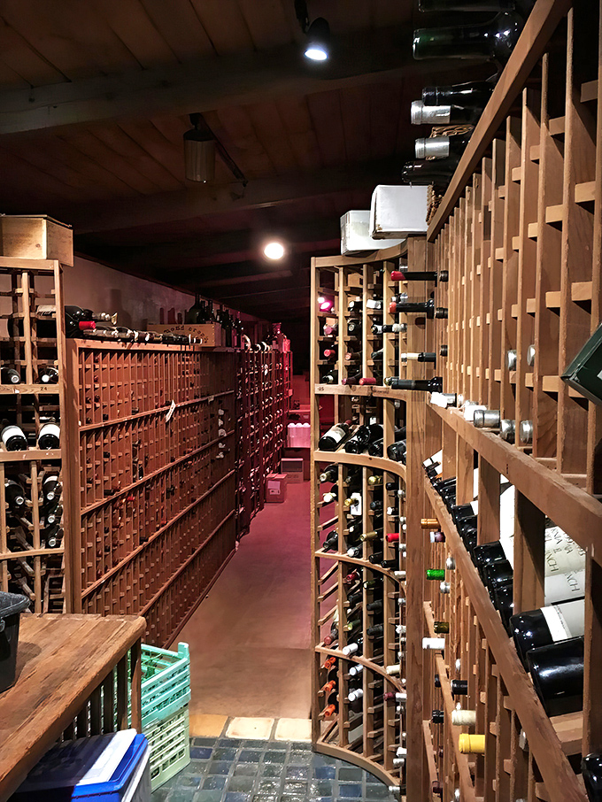 Not just a wine cellar &ndash; a wooden cathedral dedicated to the grape. Each bottle waits patiently for its perfect pairing.